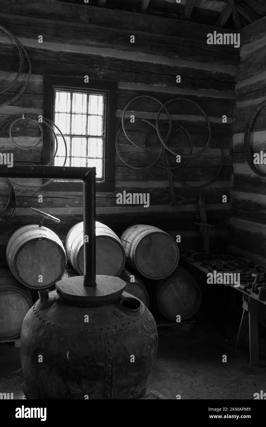 A room with a rusty round can and barrels in grayscale Stock Photo - Alamy