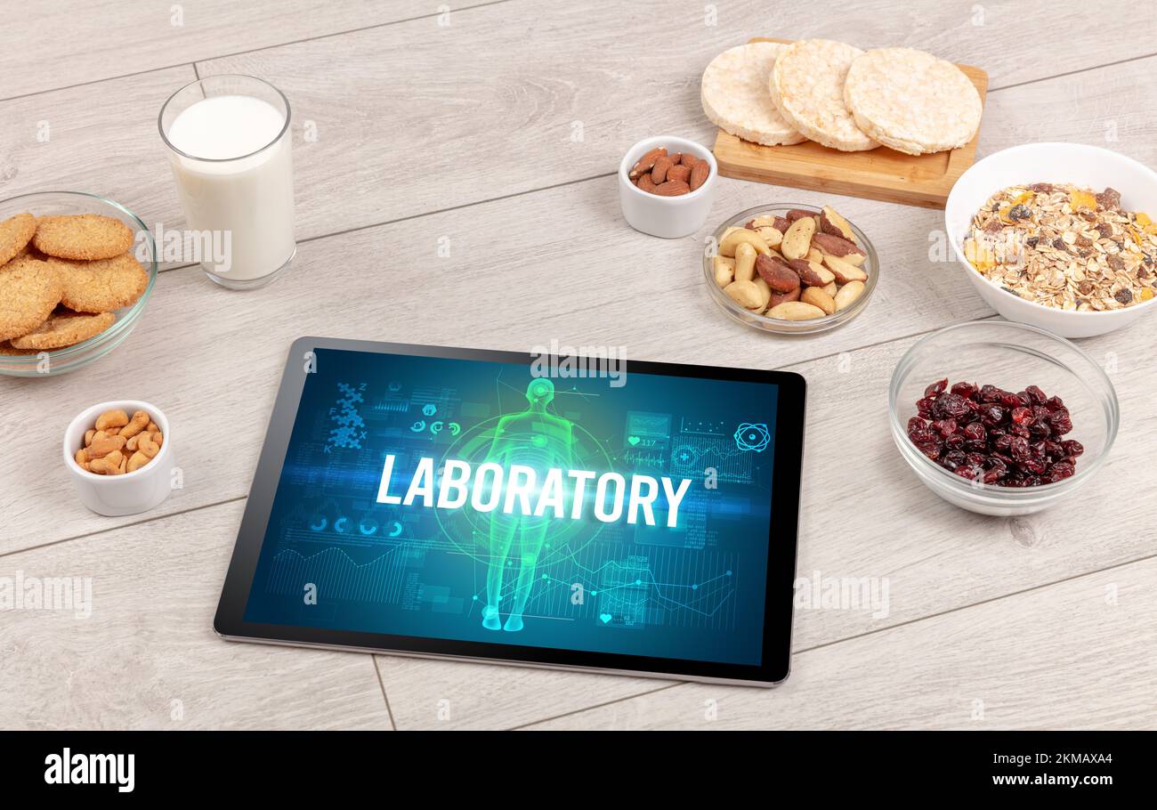 Tablet Pc with fruits, medical concept Stock Photo - Alamy