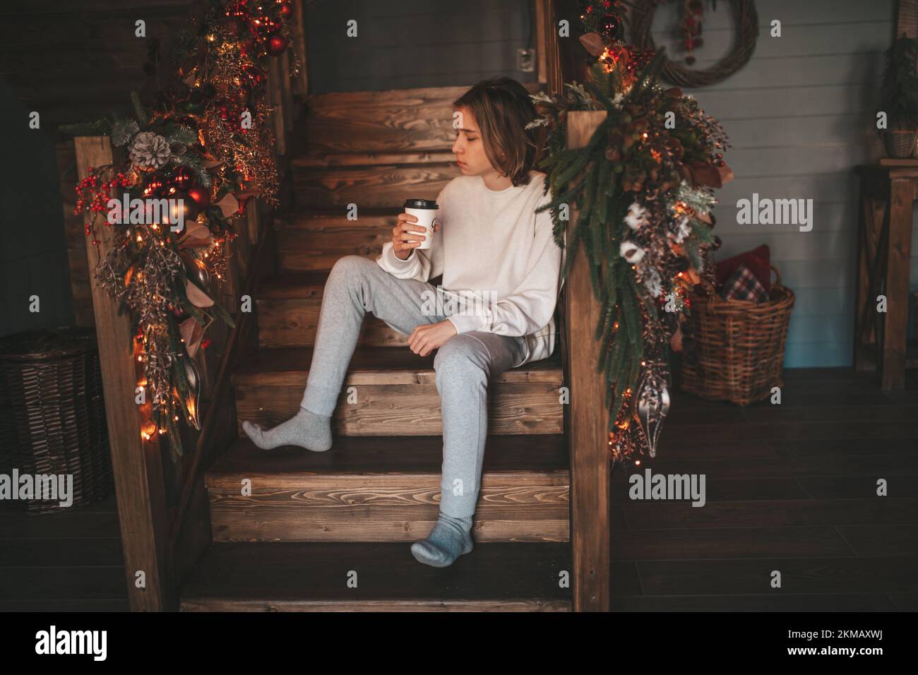 Young teen boy with long hair thoughtful look sad eyes negative mood ...