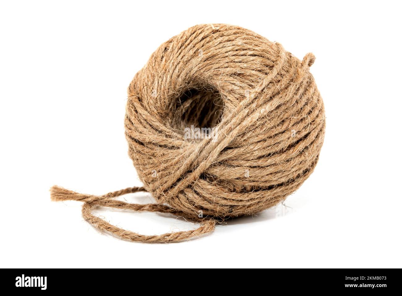 A ball of rope on a white background close-up. Harness. Jute. Twine ...