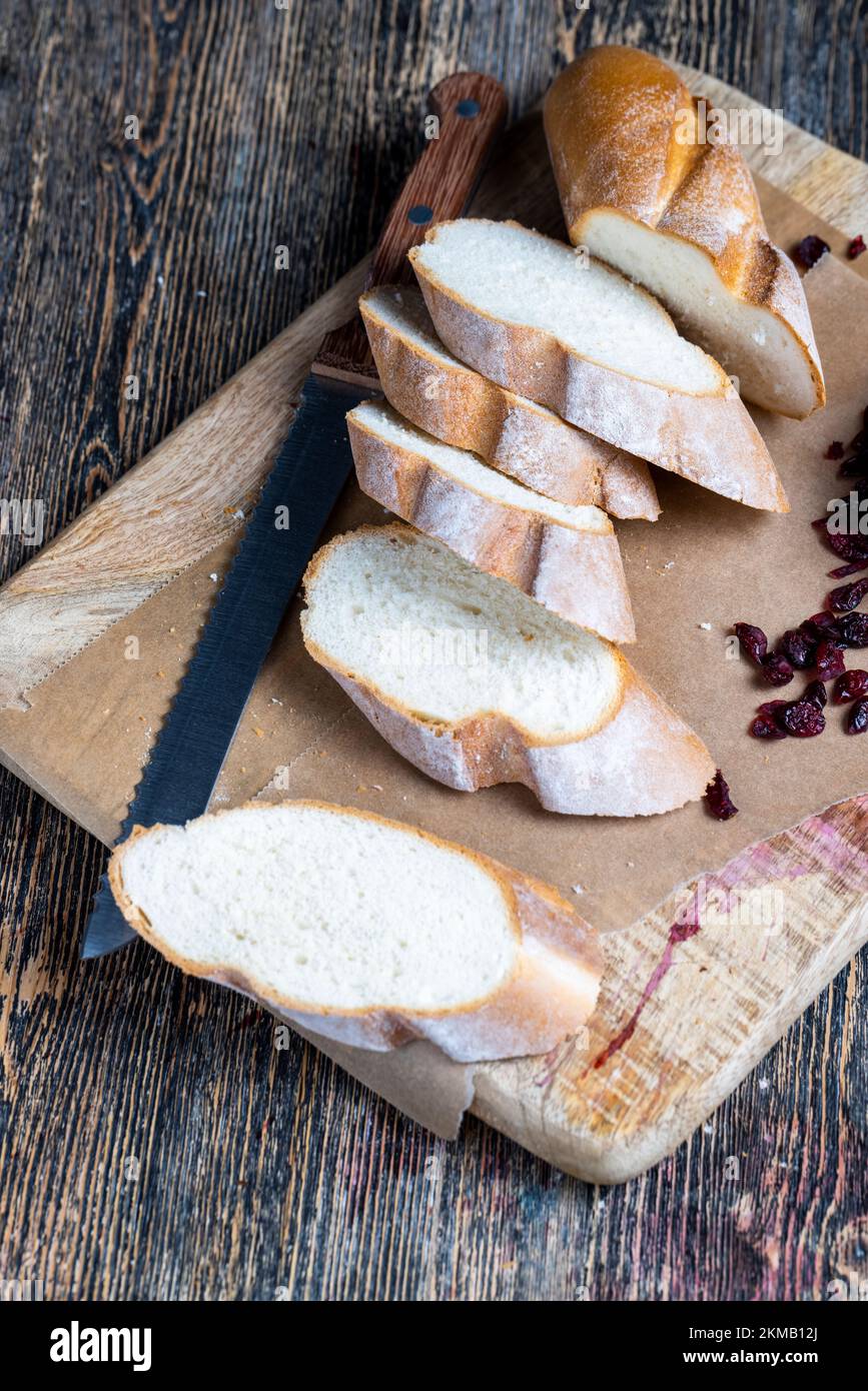 cut fresh wheat baguette into several pieces, sliced soft fresh ...