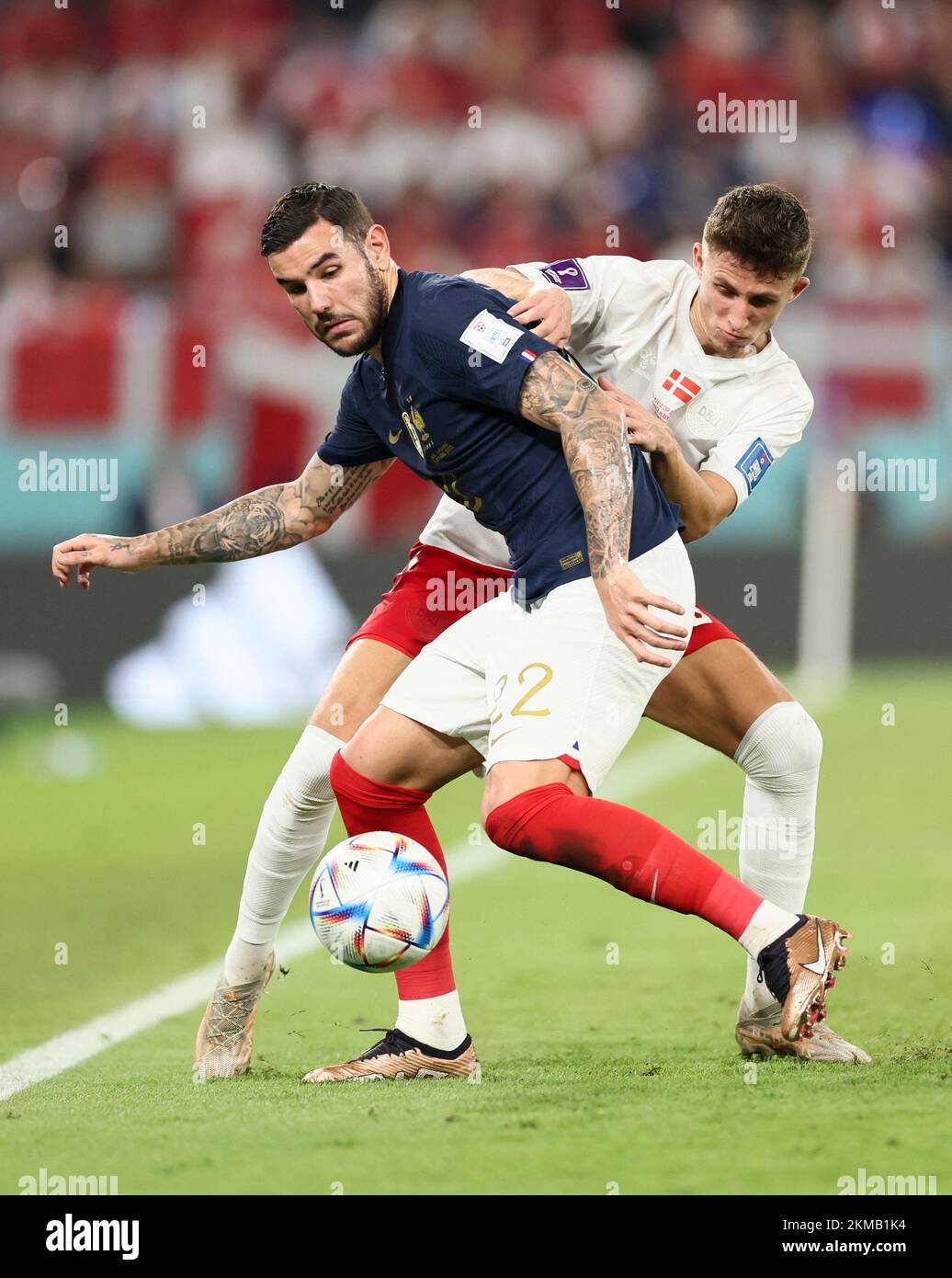 Doha, Qatar. 26th Nov, 2022. Theo Hernandez (L) of France vies with ...