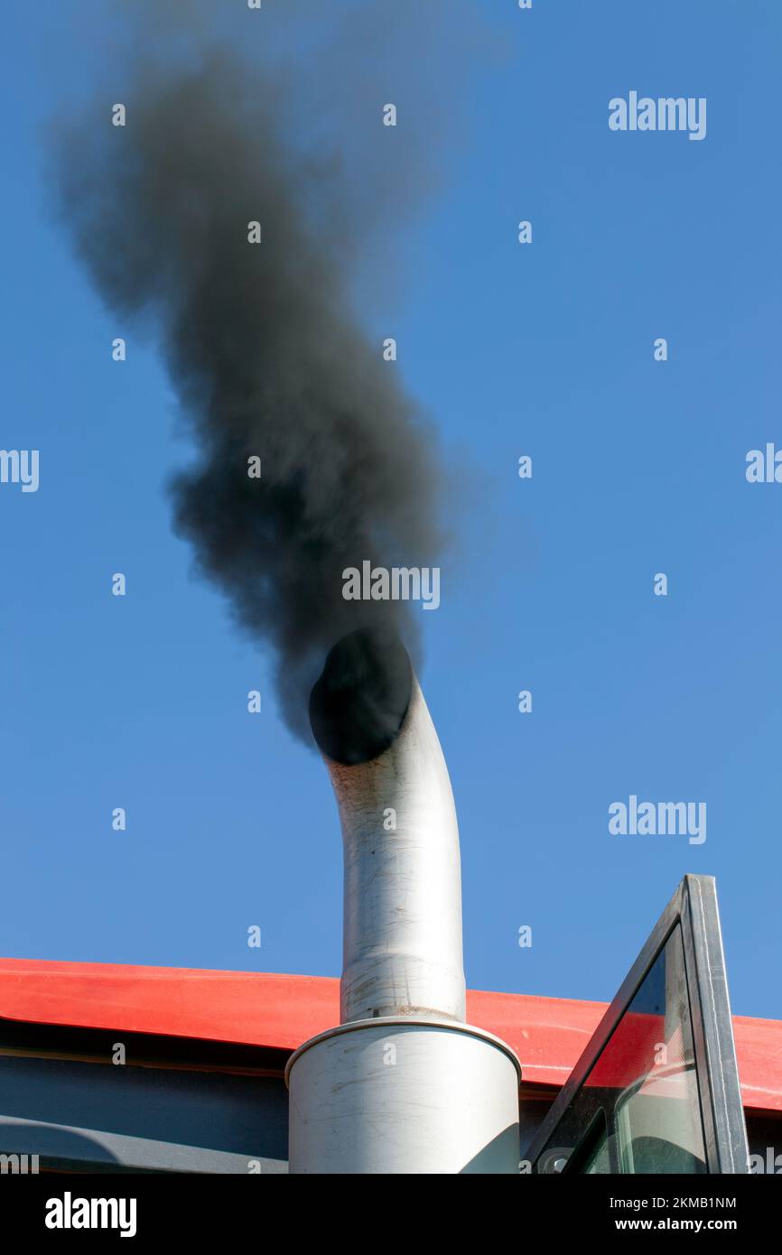 black smoke coming out of the pipe of a working car, a large amount of ...
