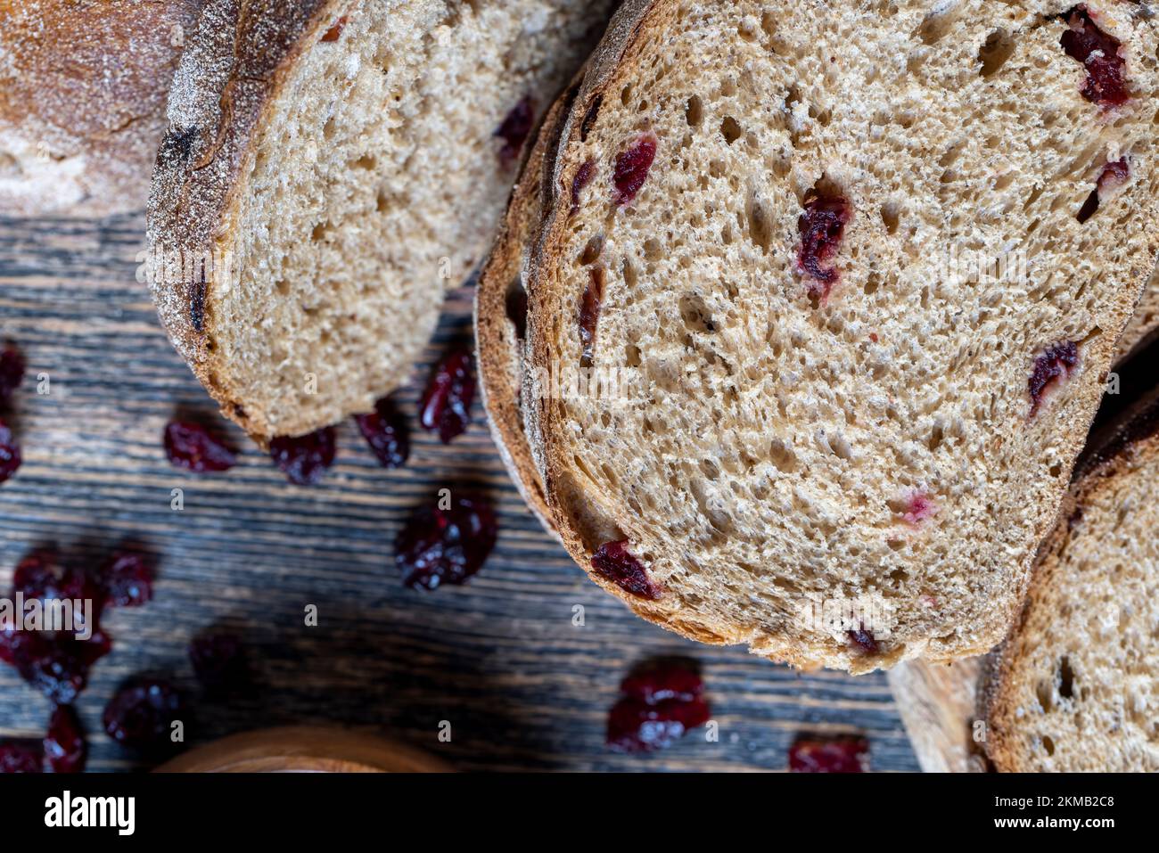 fresh cut bread made of flour and dried cranberries, red cranberry ...