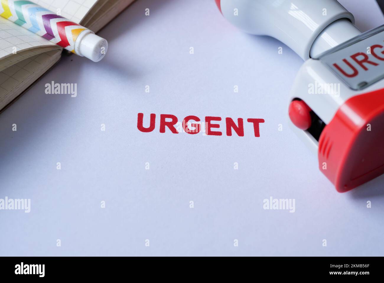 Red URGENT word stamp on a white paper Stock Photo - Alamy
