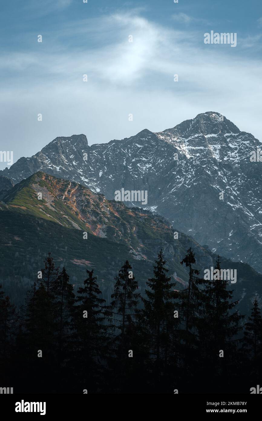 A scenic view of mountain range against a blue sky background Stock ...