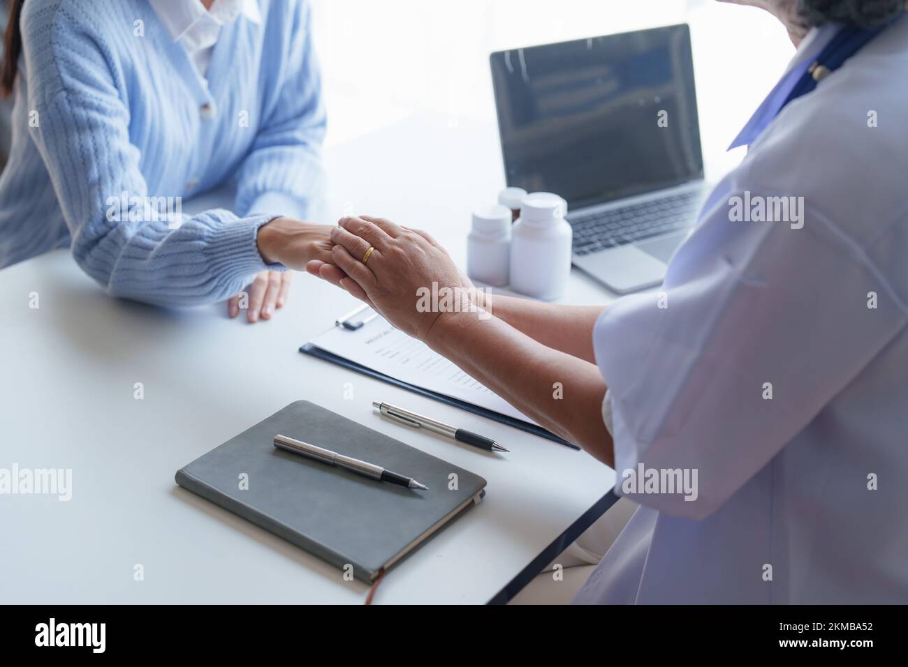 Doctor having conversation with patient while discussing explaining ...