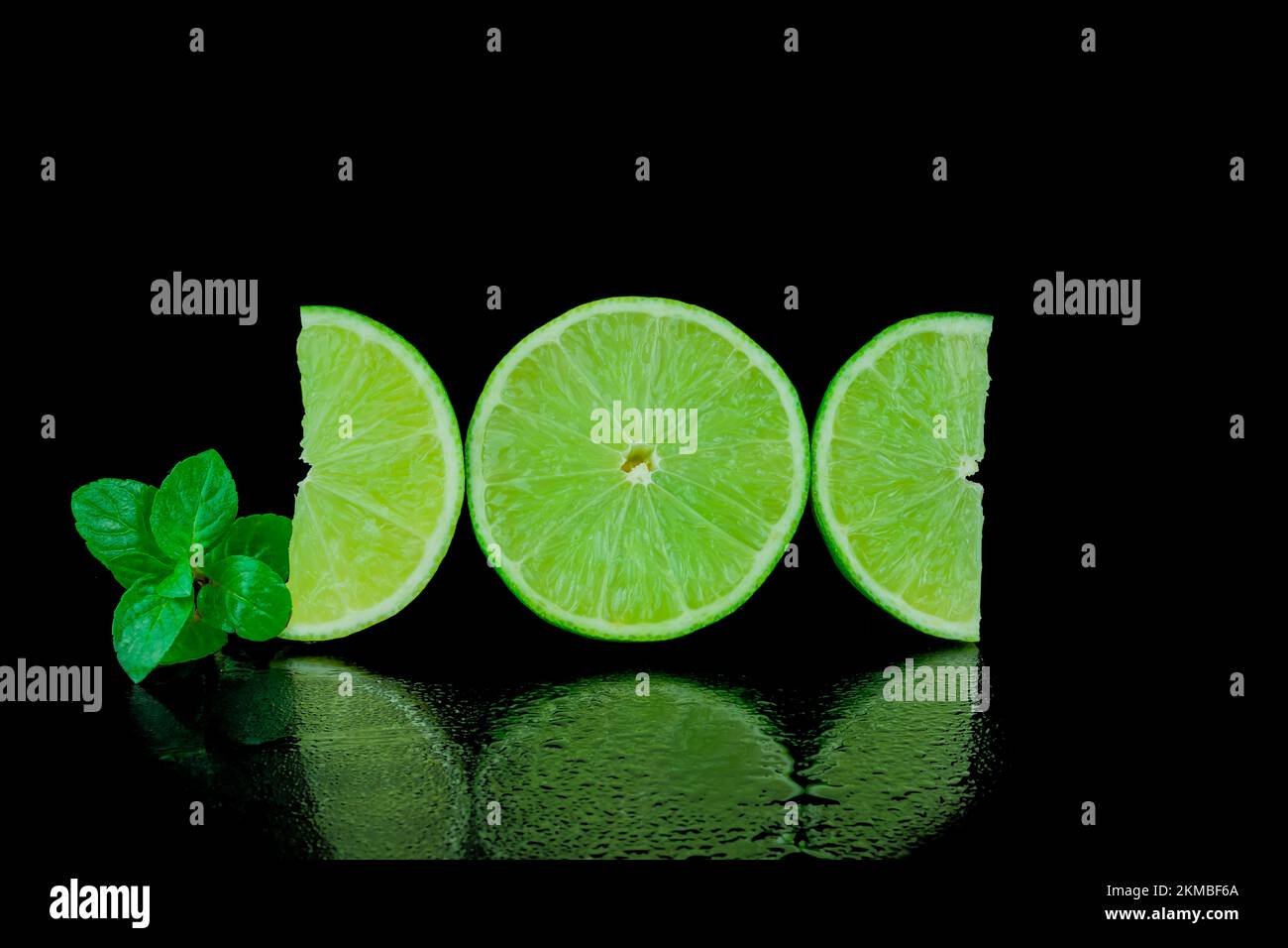 Still life, lemon and lime on black background Stock Photo - Alamy