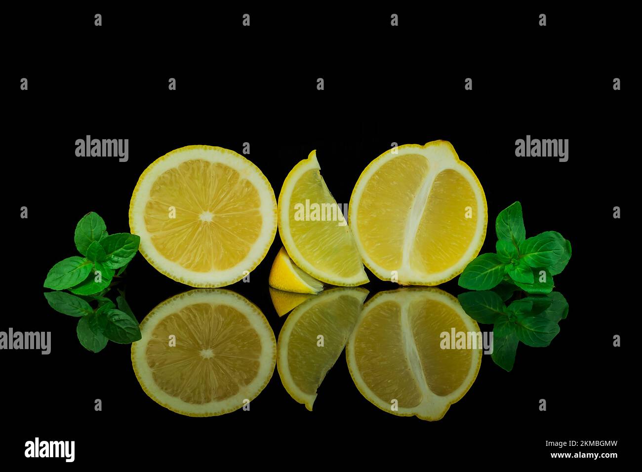 Still life, lemon and lime on black background Stock Photo - Alamy