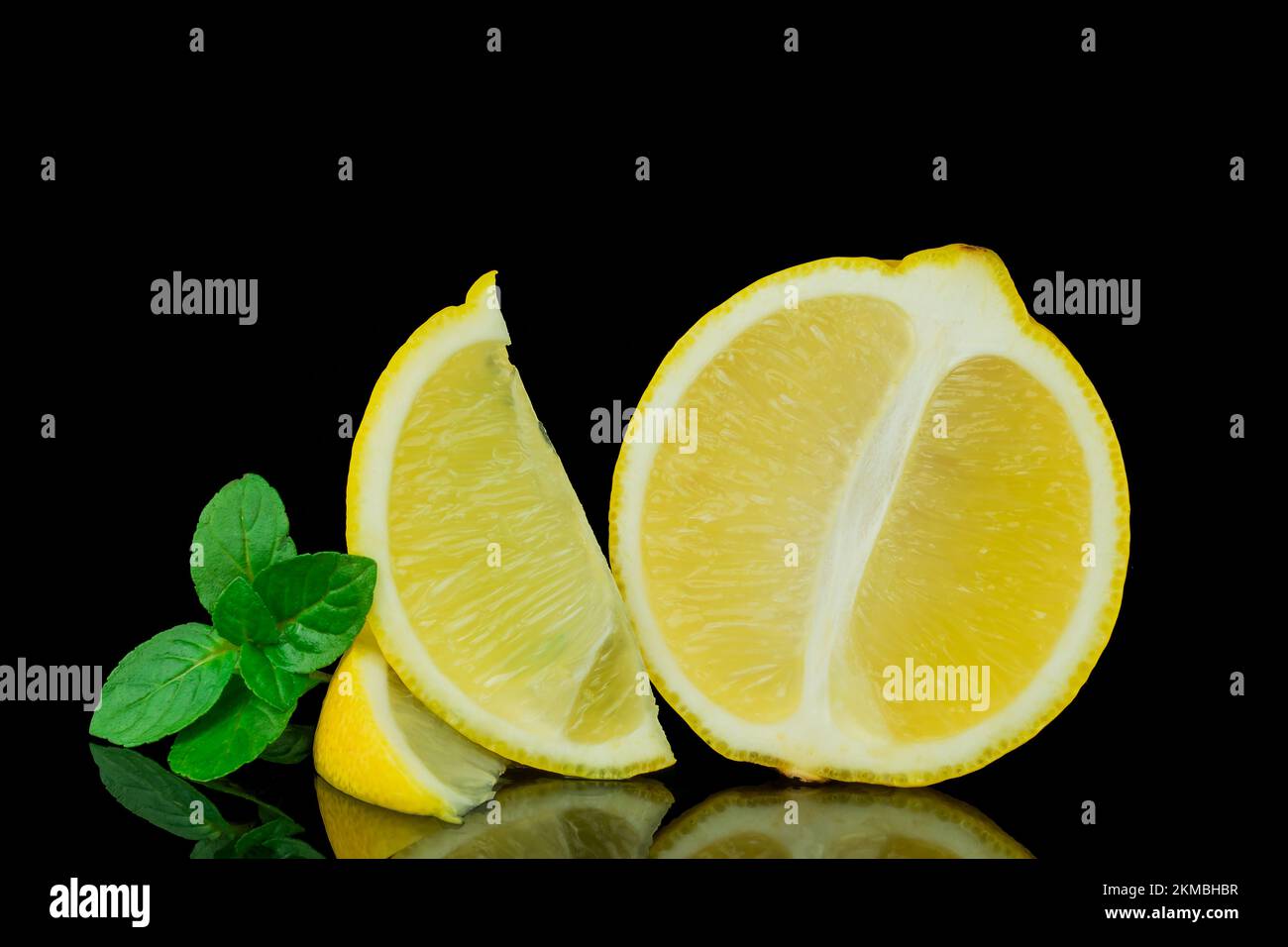 Still life, lemon and lime on black background Stock Photo - Alamy