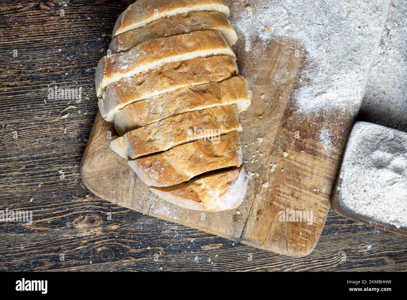 cut fresh bread into pieces while cooking with bread, the bread is cut ...