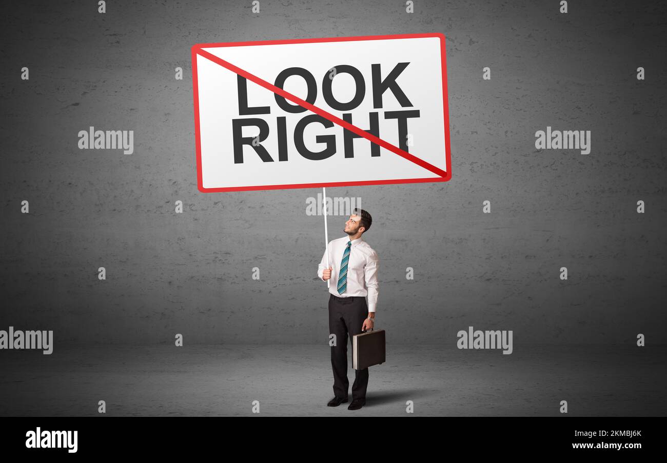 business person holding a traffic sign Stock Photo - Alamy