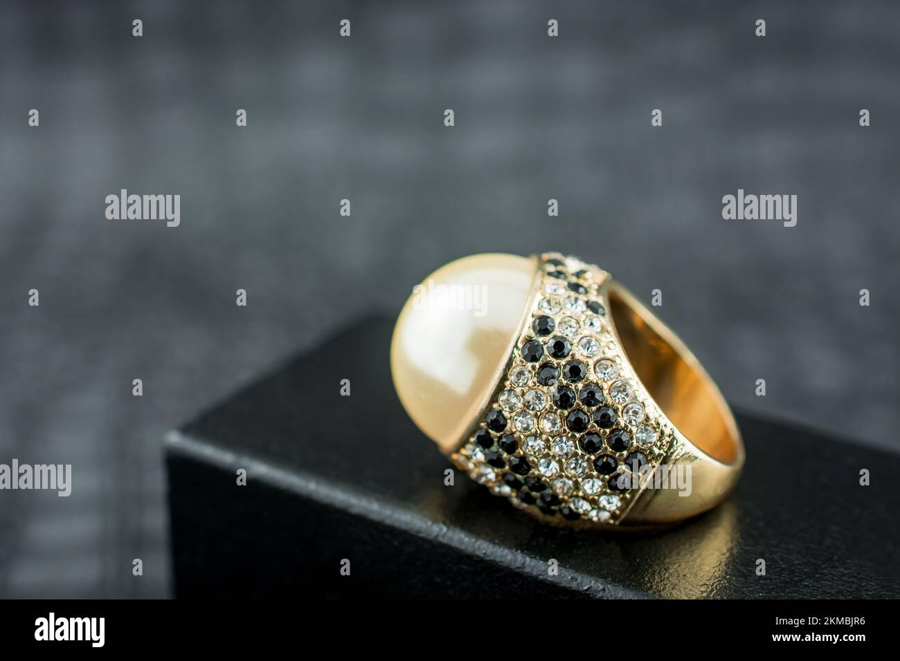 Photo of golden set with gems over dark background Stock Photo - Alamy