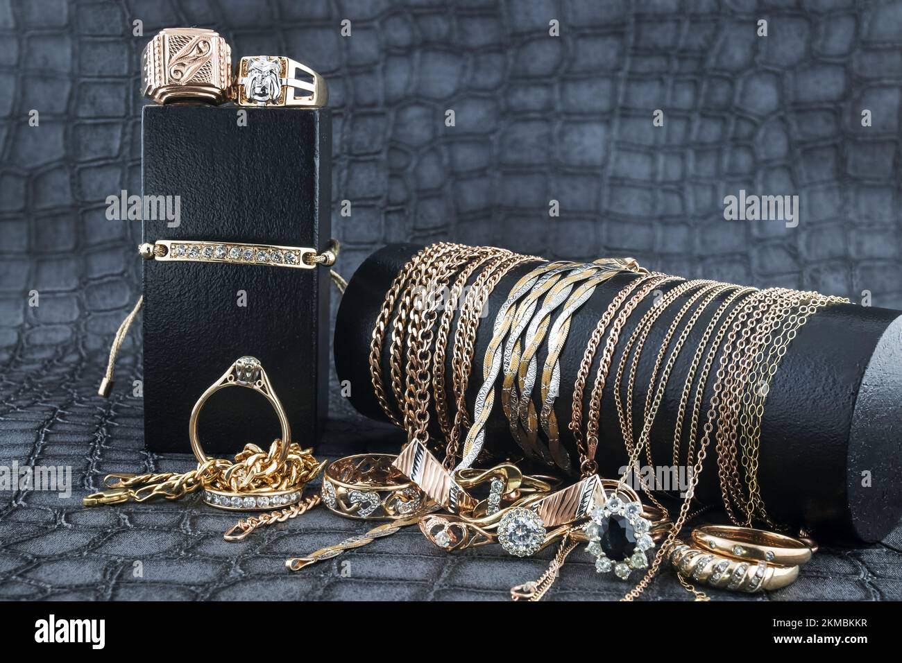 Photo of golden set with gems over dark background Stock Photo - Alamy
