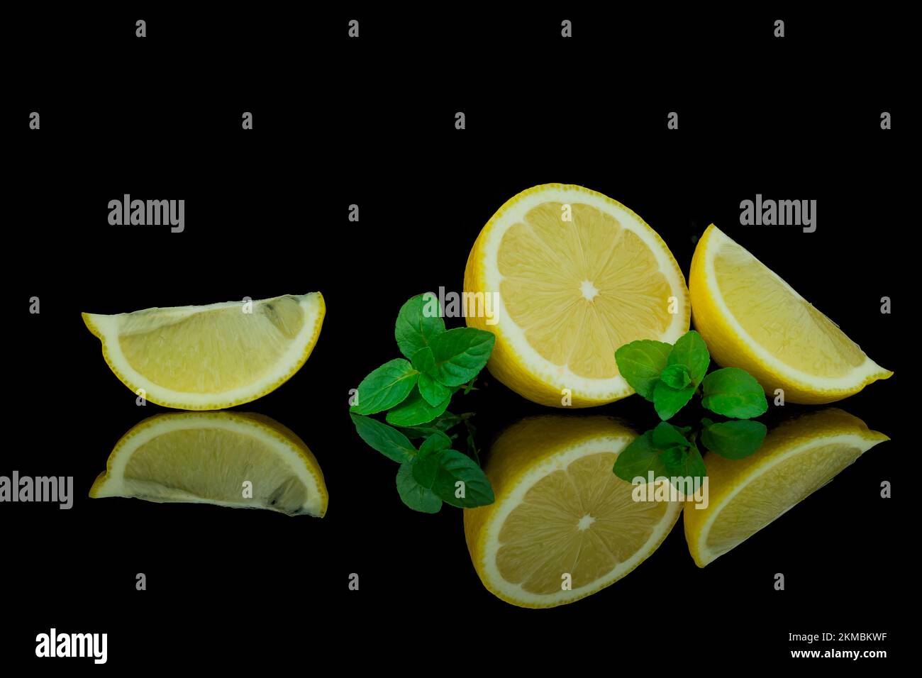 Still life, lemon and lime on black background Stock Photo - Alamy