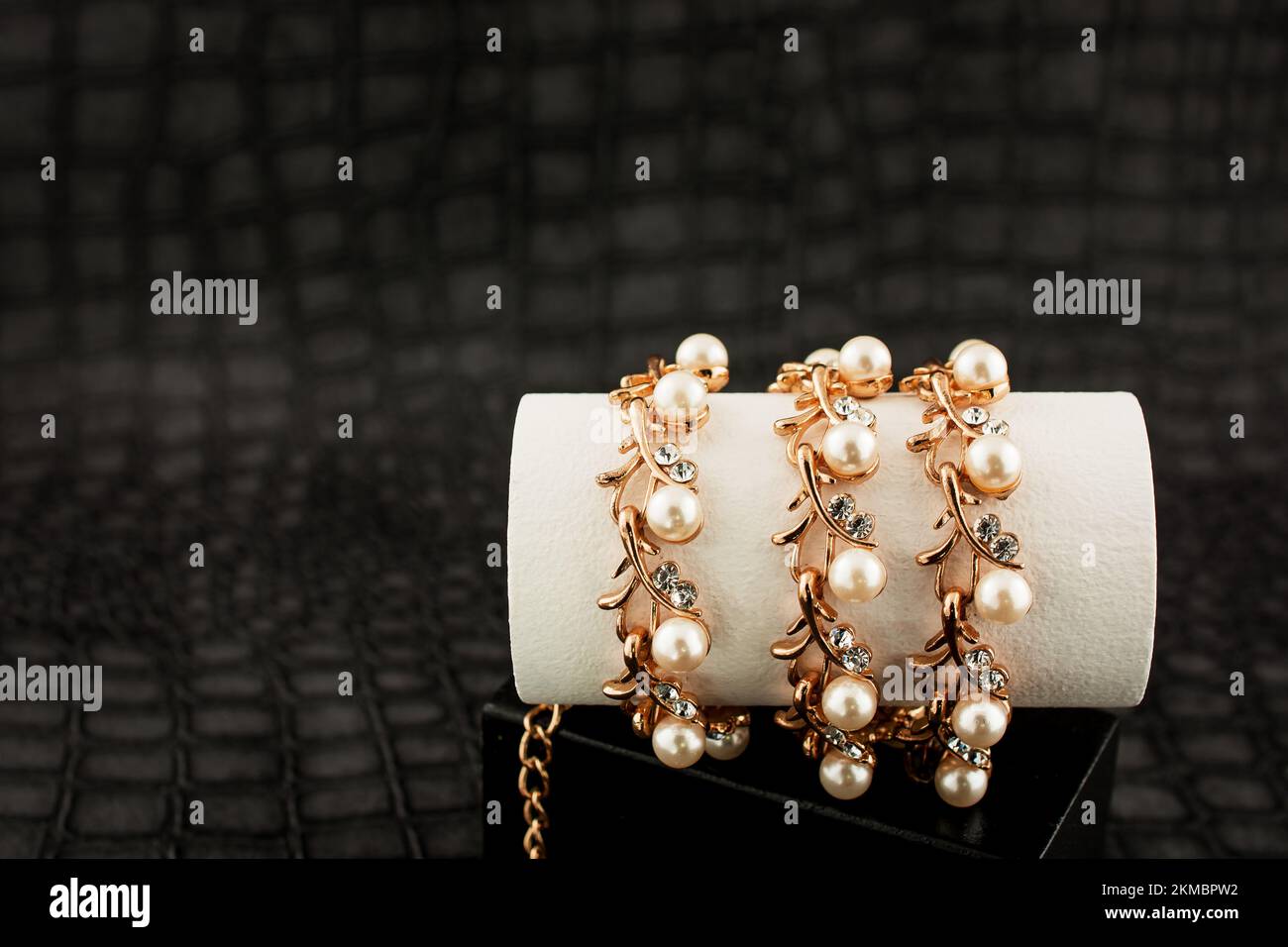 Photo of golden set with gems over dark background Stock Photo - Alamy
