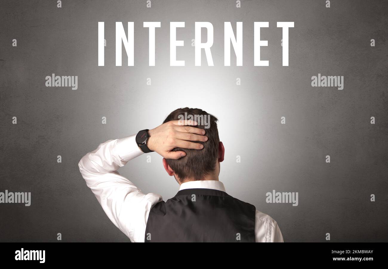 Rear view of a businessman with inscription Stock Photo - Alamy