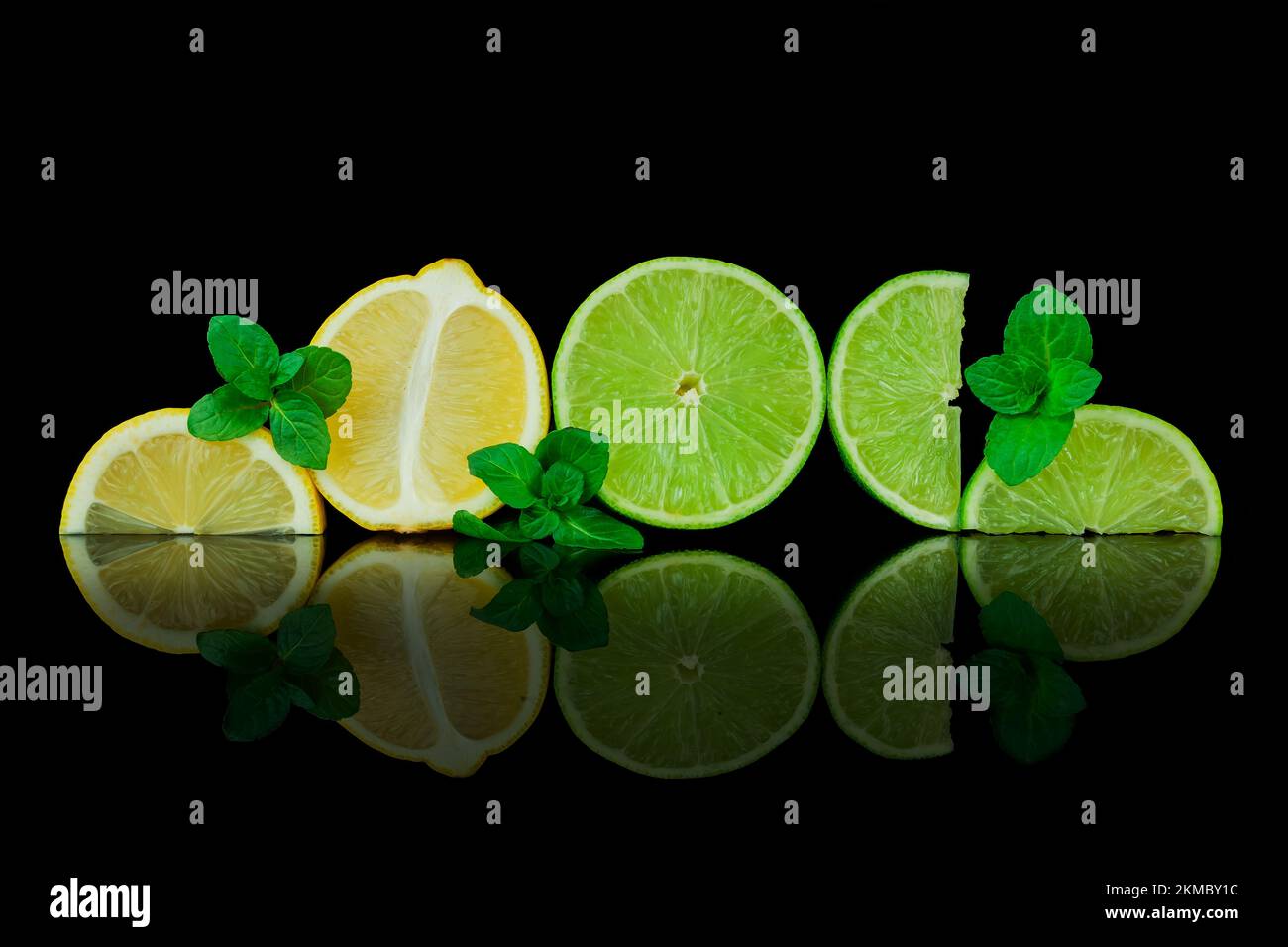 Still life, lemon and lime on black background Stock Photo - Alamy