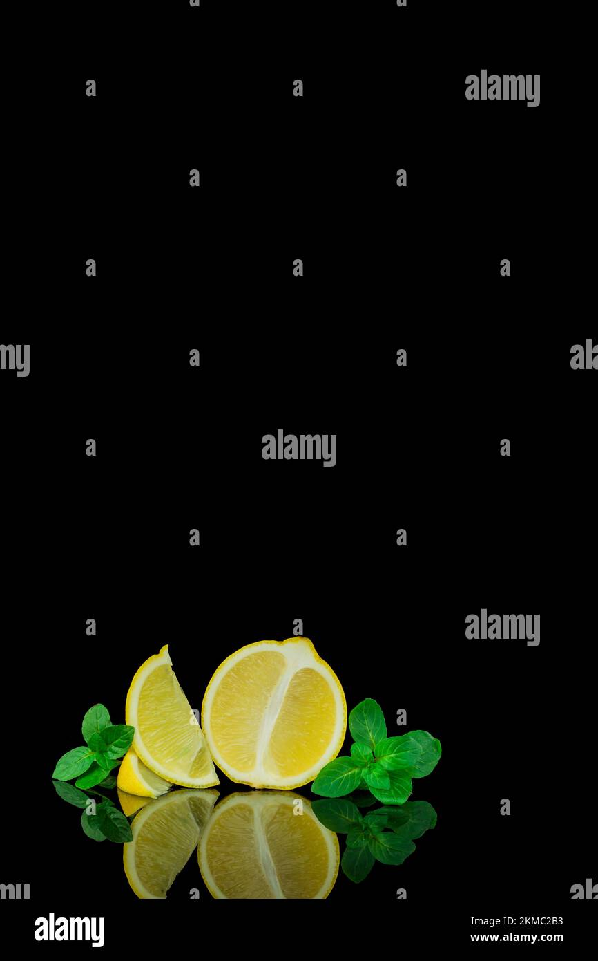 Still life, lemon and lime on black background Stock Photo - Alamy