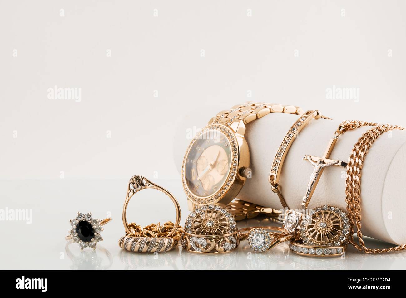 Photo of golden set with gems over white background Stock Photo - Alamy