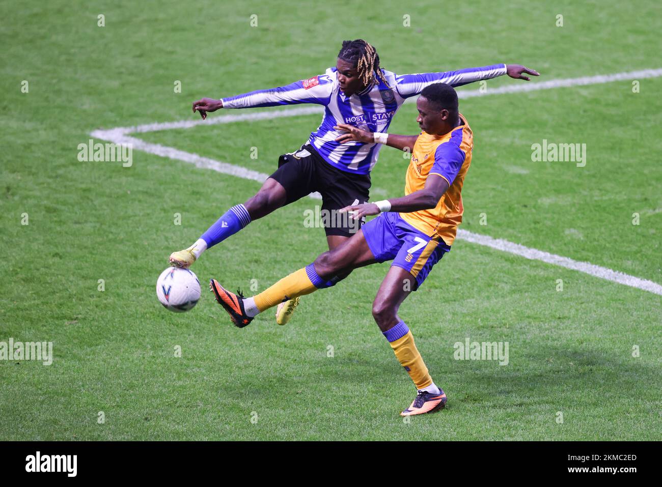 Sheffield Wednesday’s Alex Mighten (left) and Mansfield Town’s Lucas ...