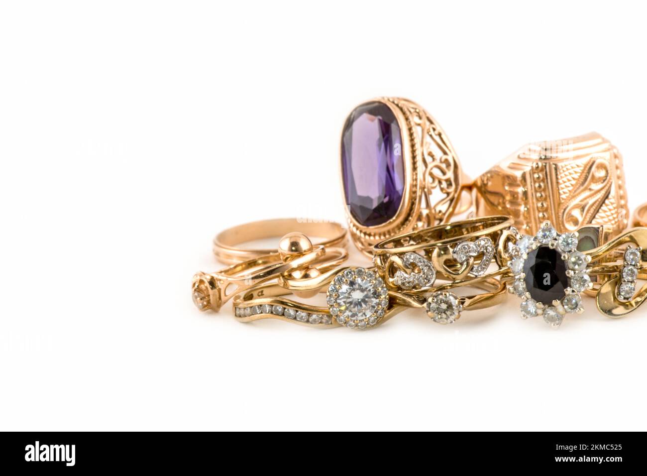 Photo of golden set with gems over white background Stock Photo - Alamy