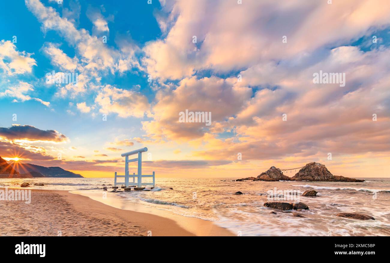 The sun setting on the horizon of the Itoshima Beach of Fukuoka where a ...