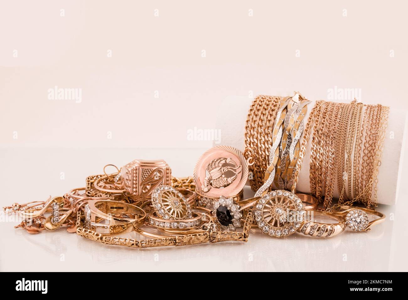 Photo of golden set with gems over white background Stock Photo - Alamy