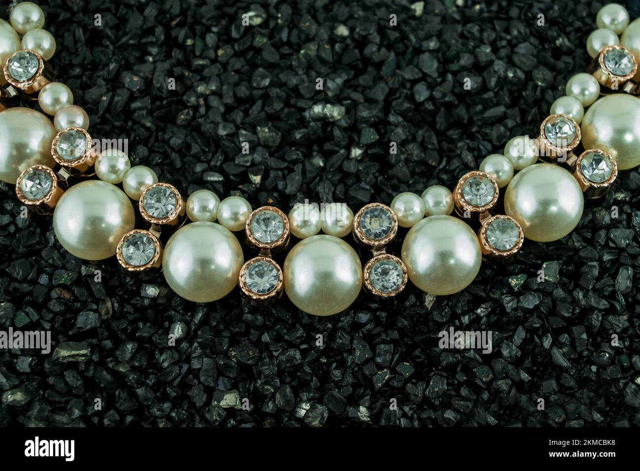 Photo of golden set with gems over dark background Stock Photo - Alamy