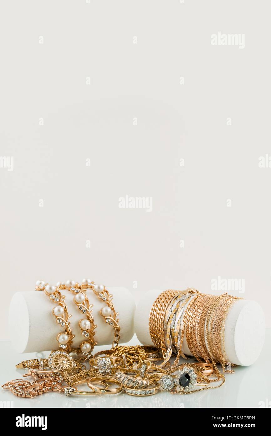 Photo of golden set with gems over white background Stock Photo - Alamy