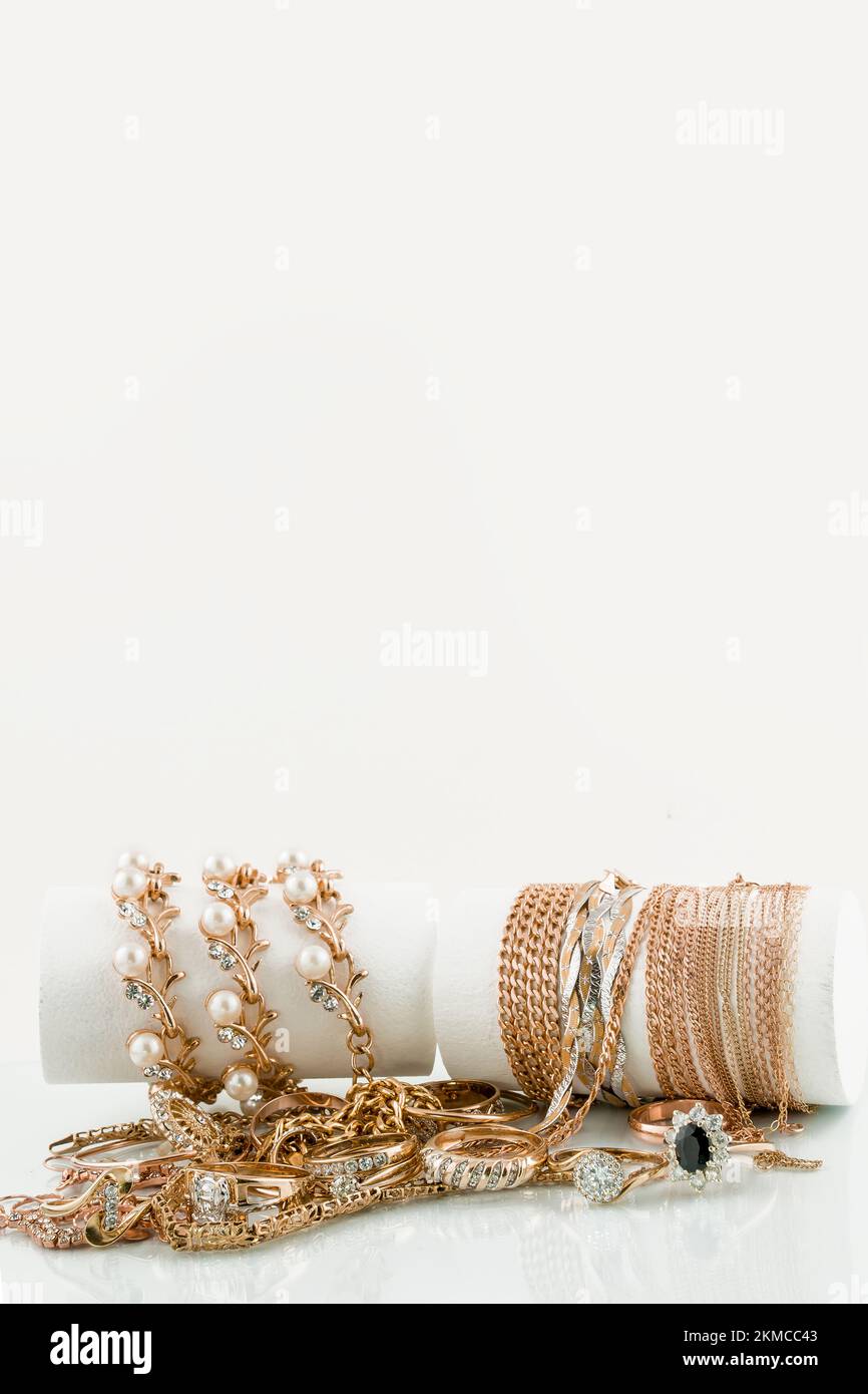 Photo of golden set with gems over white background Stock Photo - Alamy