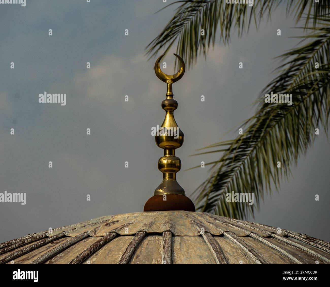 A beautiful closeup of a dome of mosque with an Islamic symbol of moon ...