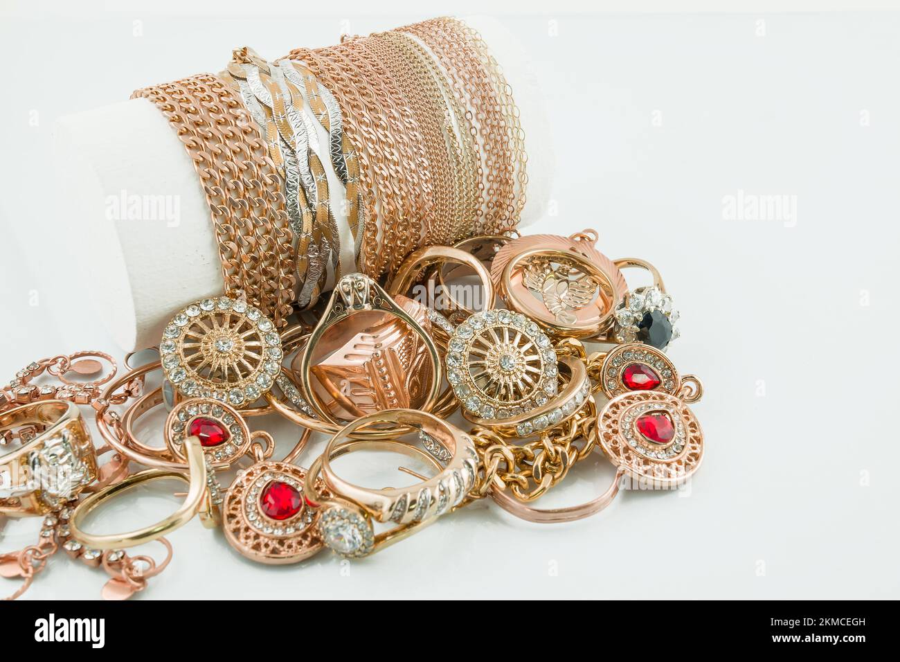 Photo of golden set with gems over white background Stock Photo - Alamy