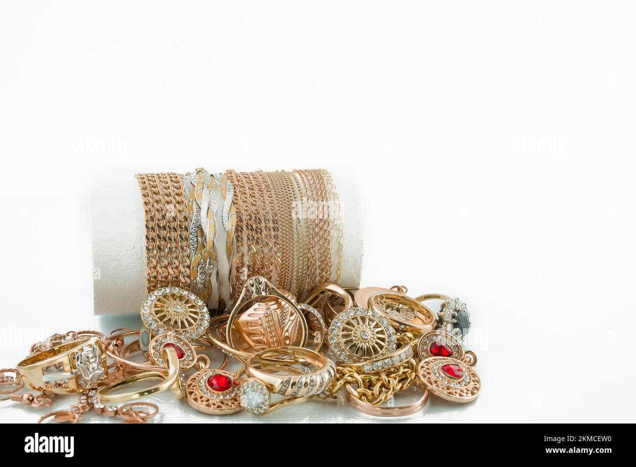 Photo of golden set with gems over white background Stock Photo - Alamy