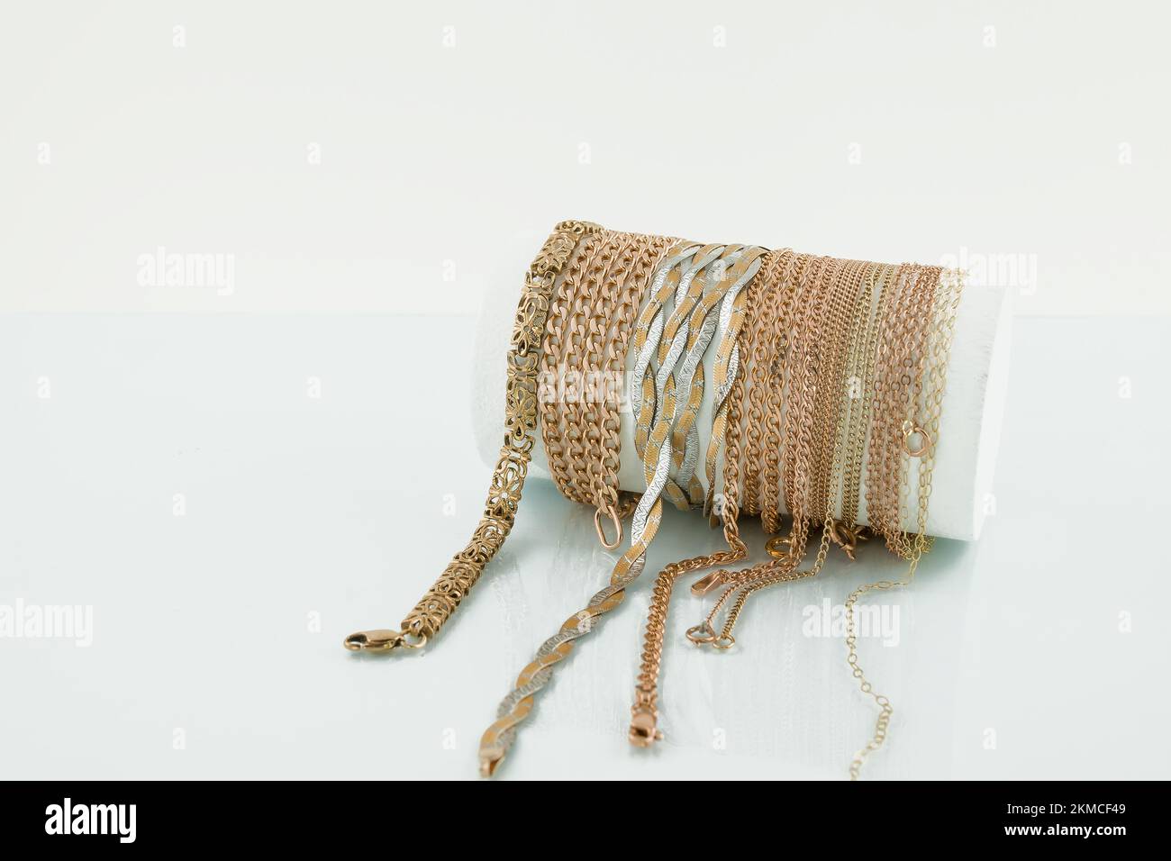Photo of golden set with gems over white background Stock Photo - Alamy
