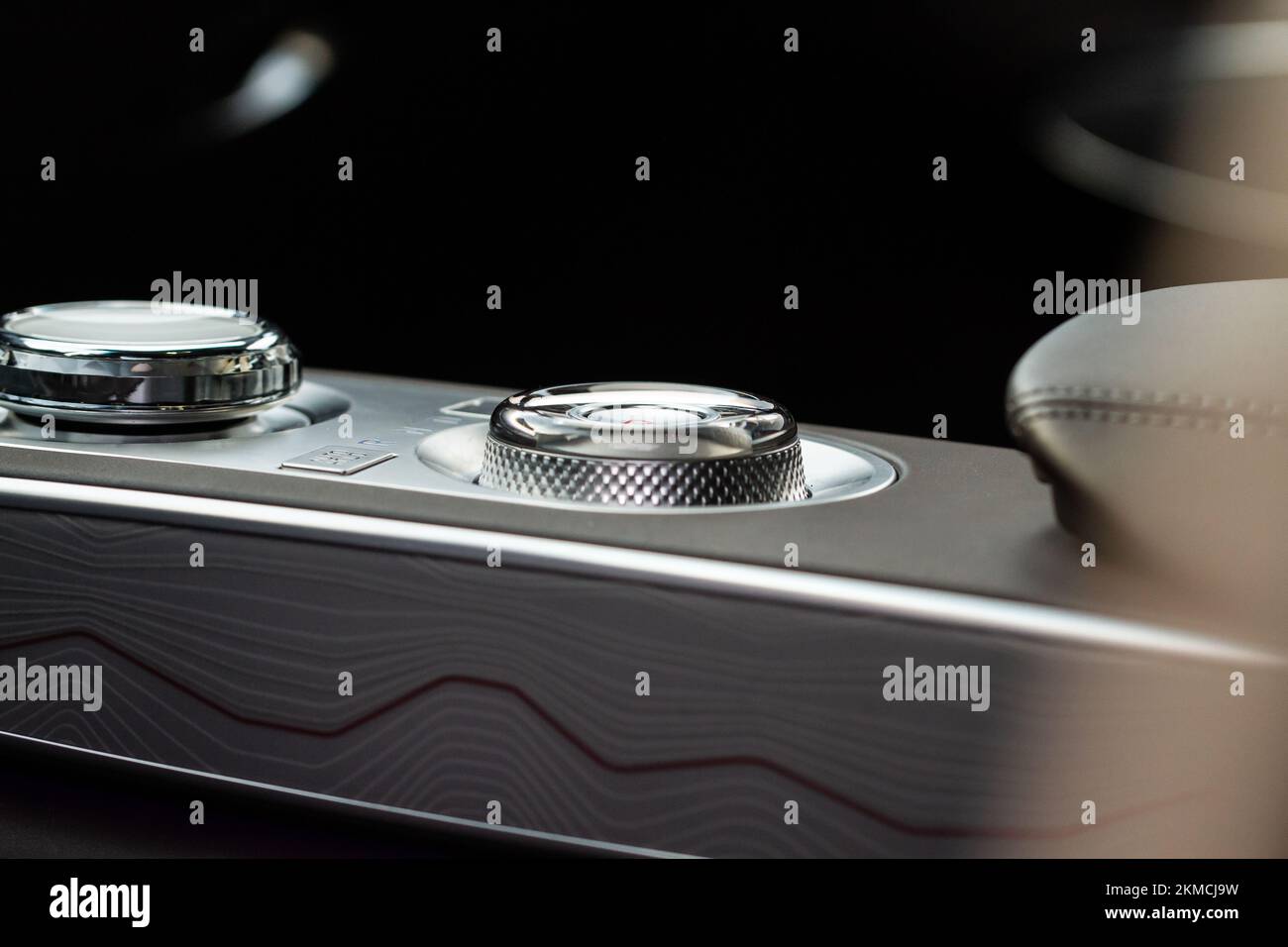 Modern car interior close up view with metallic and plastic details ...