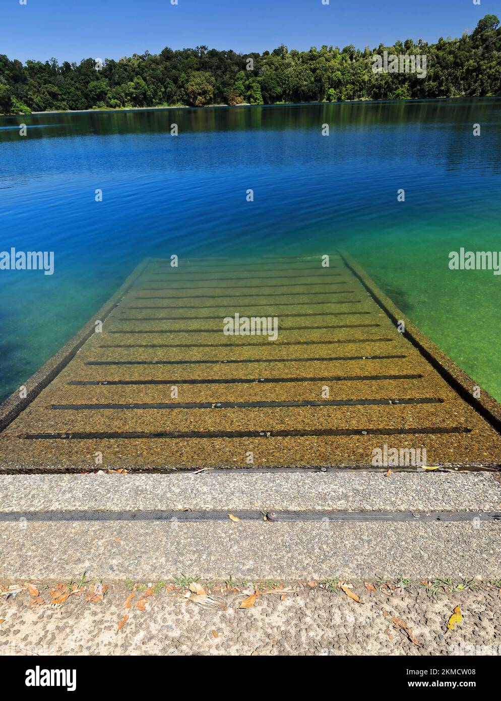 288 Boat ramp made of aggregate material entering the green-blue water ...