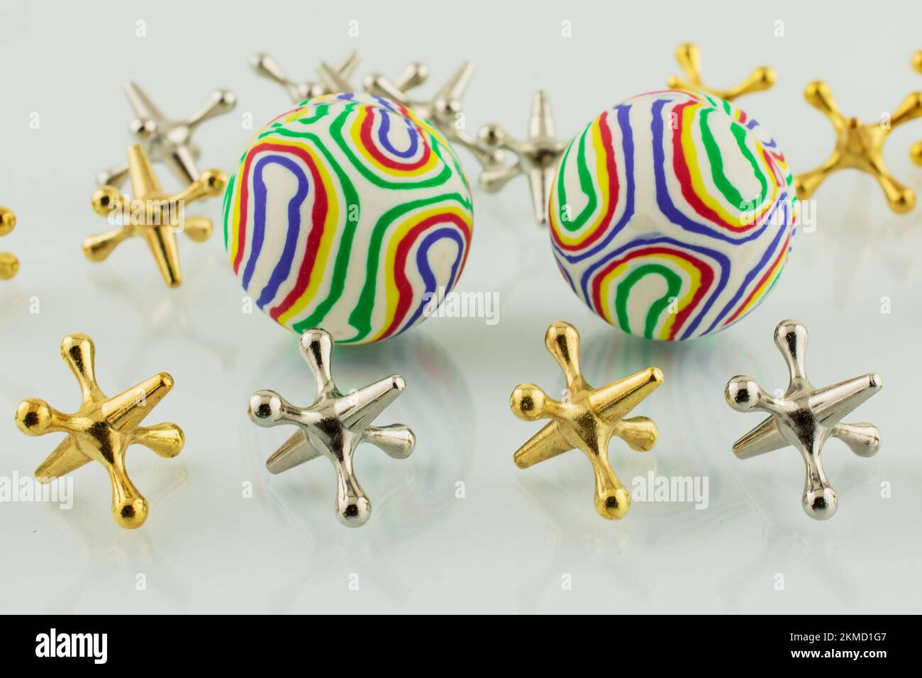 colorful jacks balls on white Stock Photo - Alamy