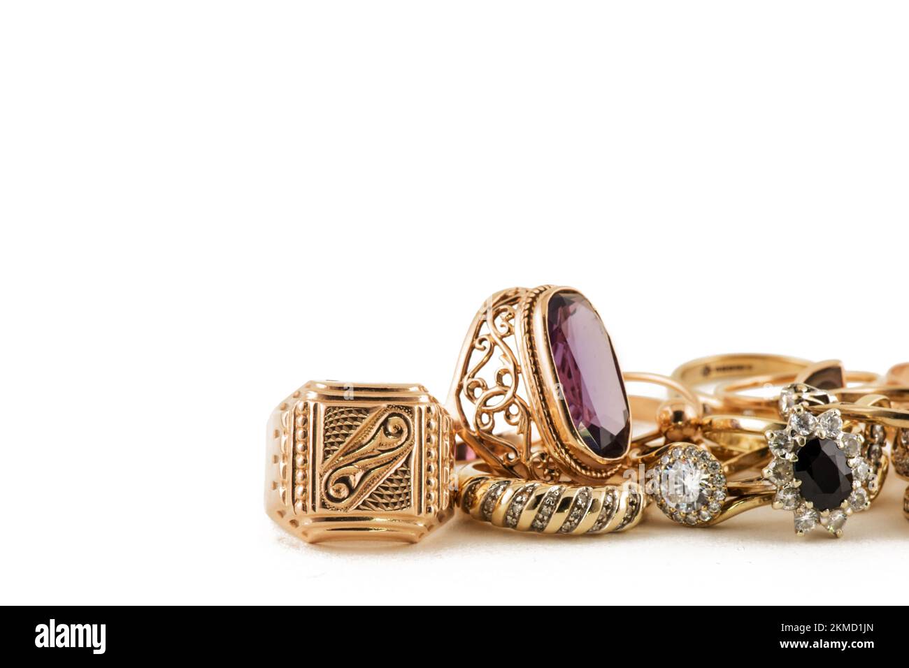 Photo of golden set with gems over white background Stock Photo - Alamy