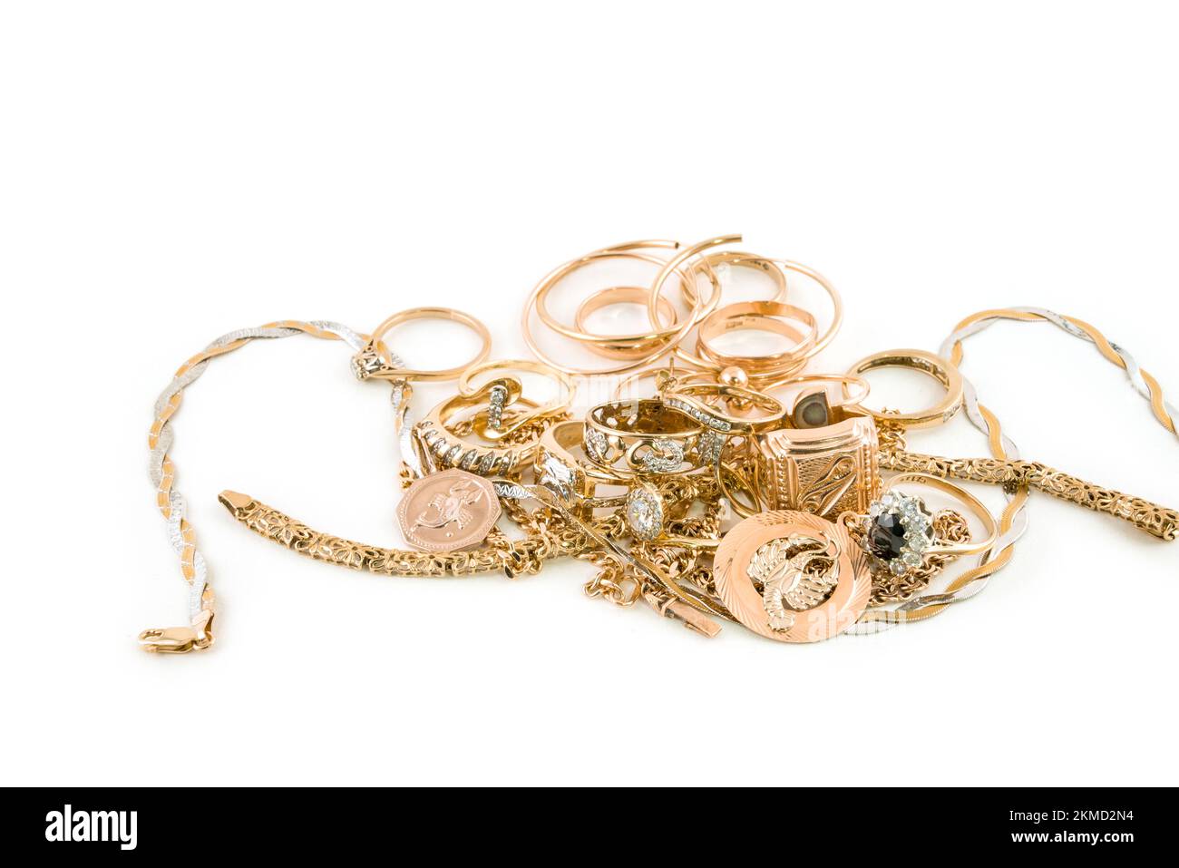 Photo of golden set with gems over white background Stock Photo - Alamy