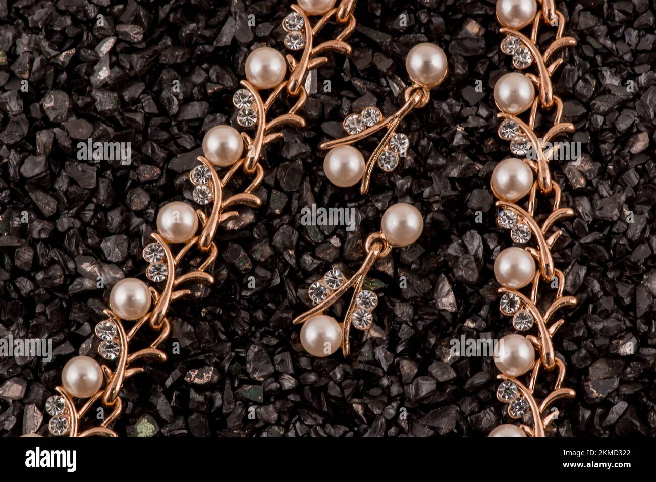 Photo of golden set with gems over dark background Stock Photo - Alamy