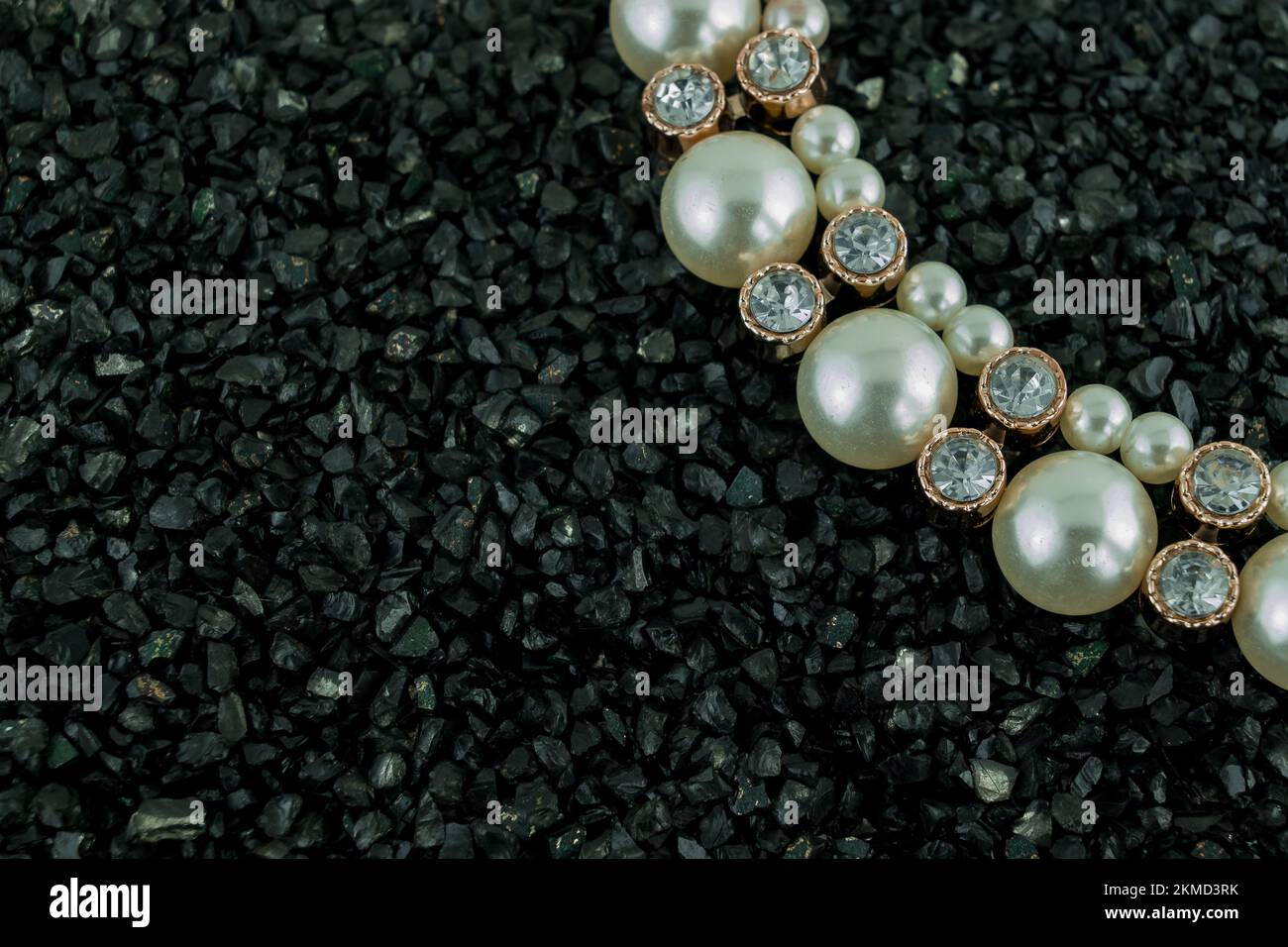 Photo of golden set with gems over dark background Stock Photo - Alamy