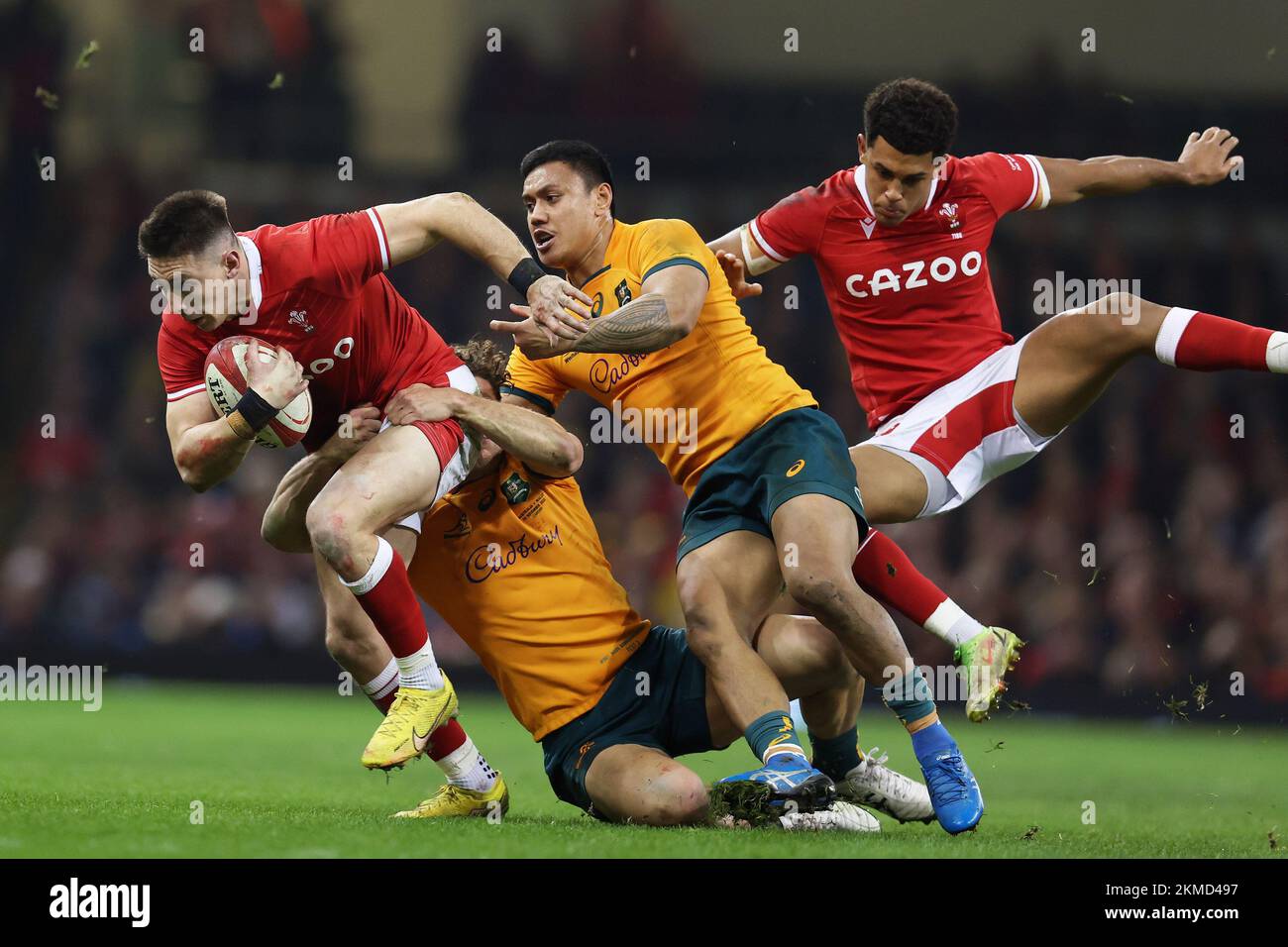 Cardiff, UK. 26th Nov, 2022. Josh Adams of Wales (l) attempts to break ...