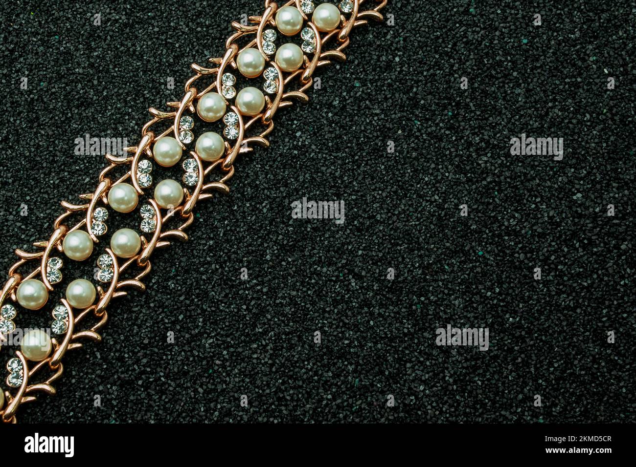 Photo of golden set with gems over dark background Stock Photo - Alamy