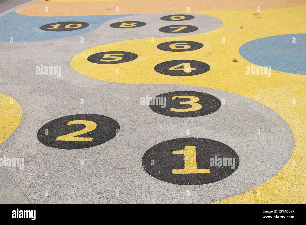 Children's game with numbers in circles on the playground on the roads ...