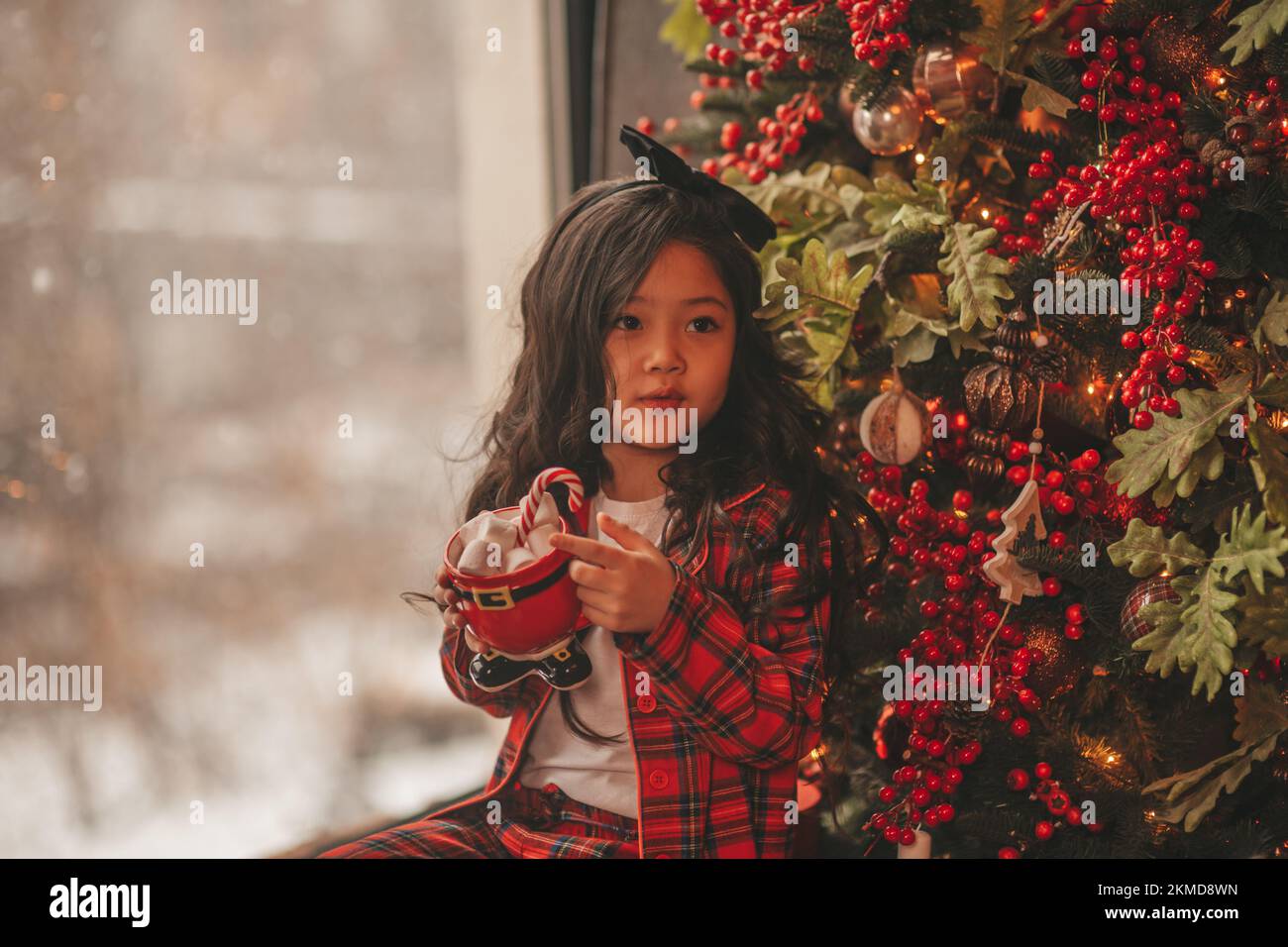 Happy japan little girl dreamer waiting miracle Santa enjoy sweets near ...