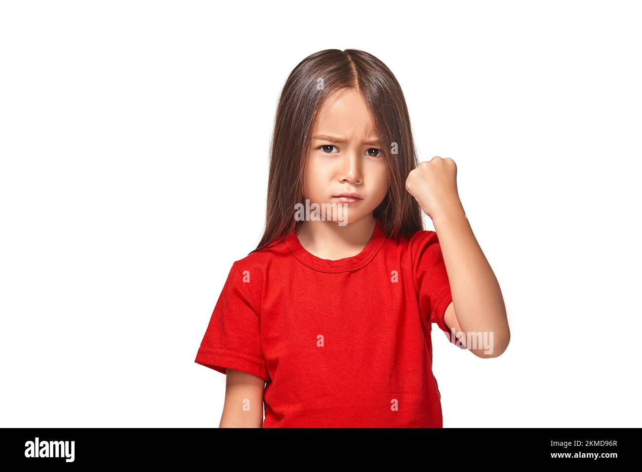 Beautiful girl in red t-shirt shakes her fist Stock Photo - Alamy