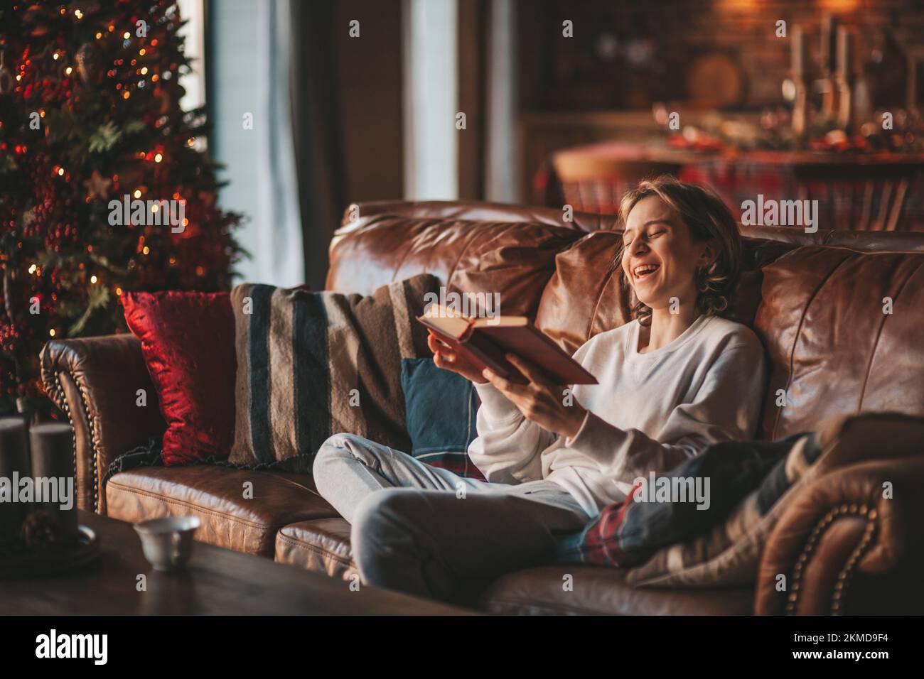 Young emotional cheerful teen boy with long hair laughter and joyful at ...