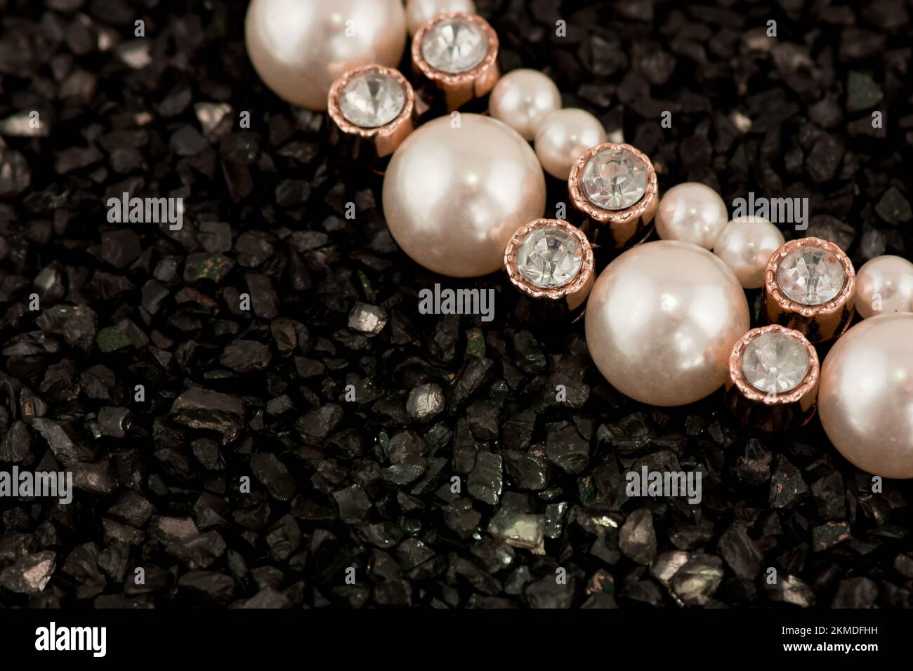 Photo of golden set with gems over dark background Stock Photo - Alamy