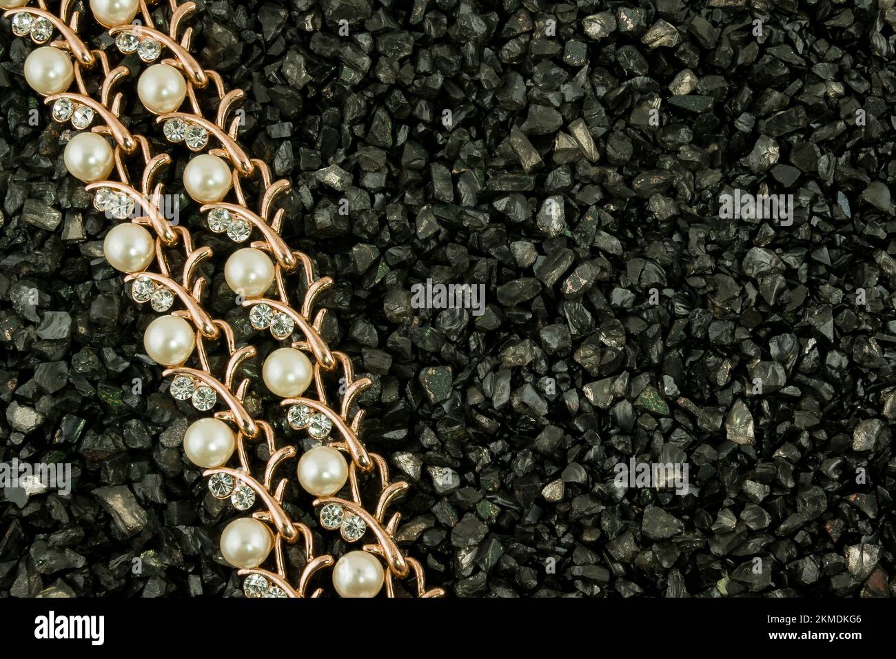 Photo of golden set with gems over dark background Stock Photo - Alamy